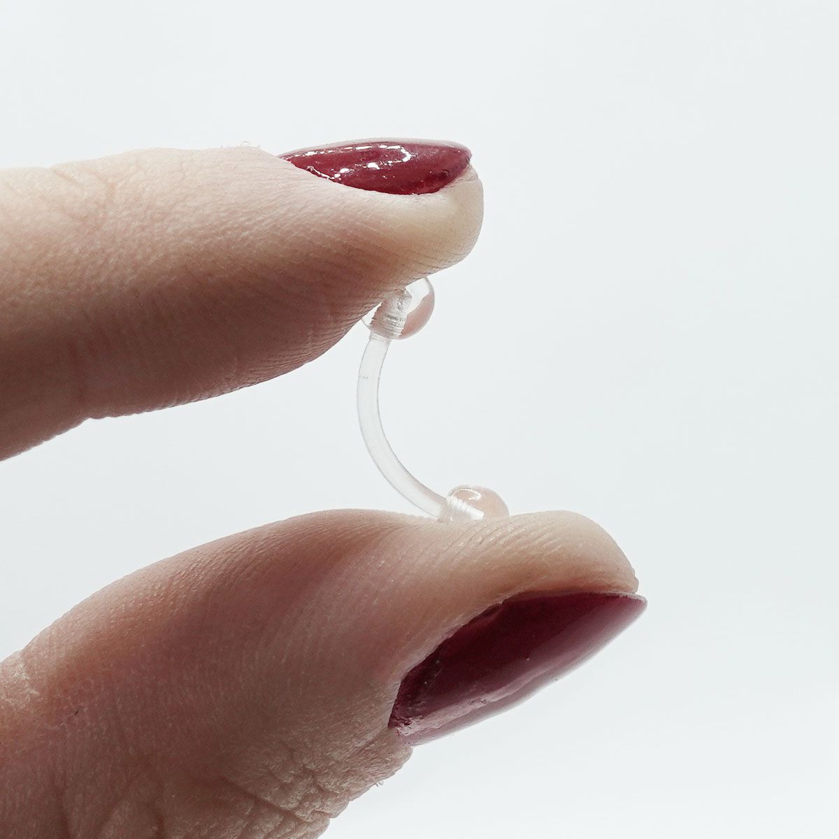 Piercing Microbell Curvo em Bioflex Transparente - Escola do Piercing